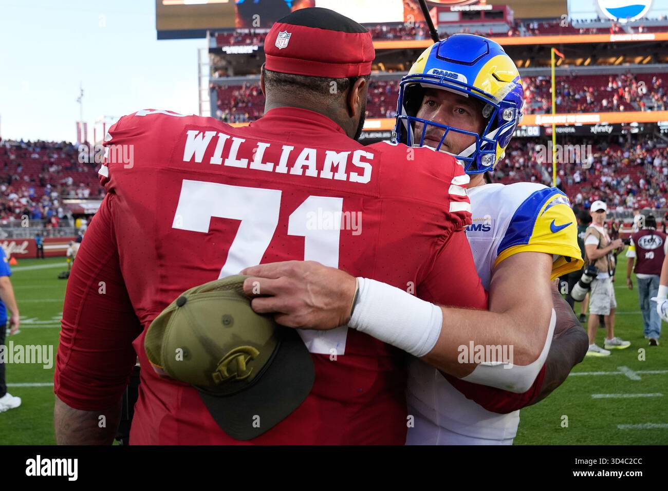 San Francisco 49ers offensive tackle Trent Williams (71) hugs Los ...
