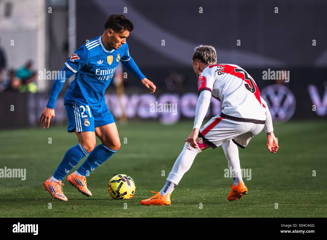 Brahim Diaz of Real Madrid dribbling Pep Chavarria of Rayo Vallecano ...