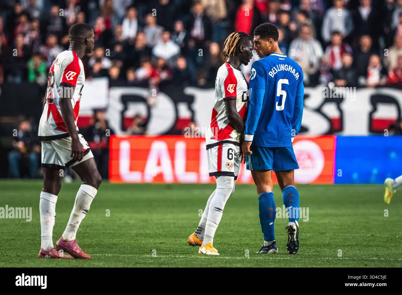 Jude Bellingham of Real Madrid and Pathe Ciss of Rayo Vallecano head to ...