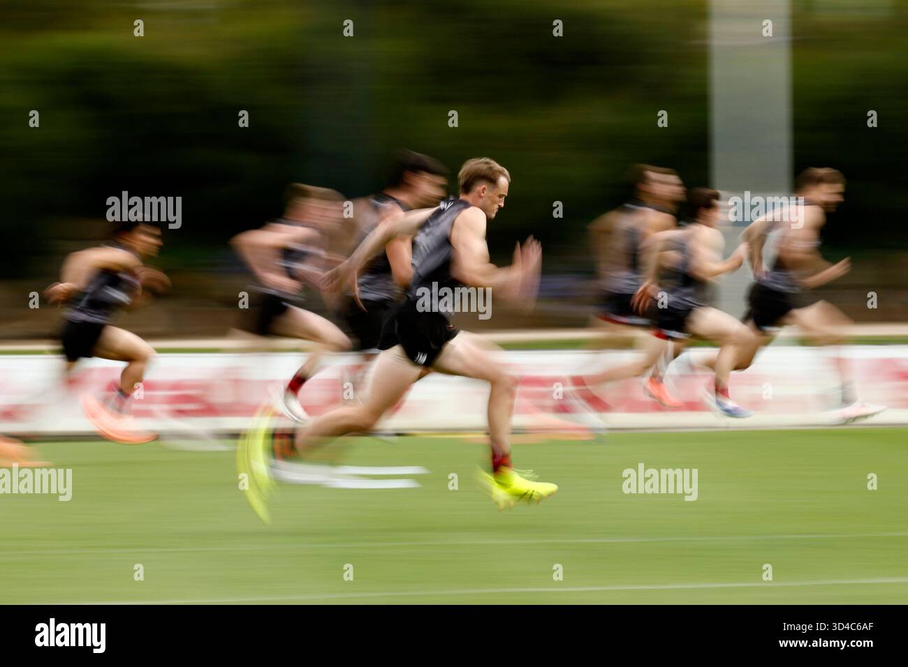 Mason Redman runs during an Essendon Bombers AFL training session at ...