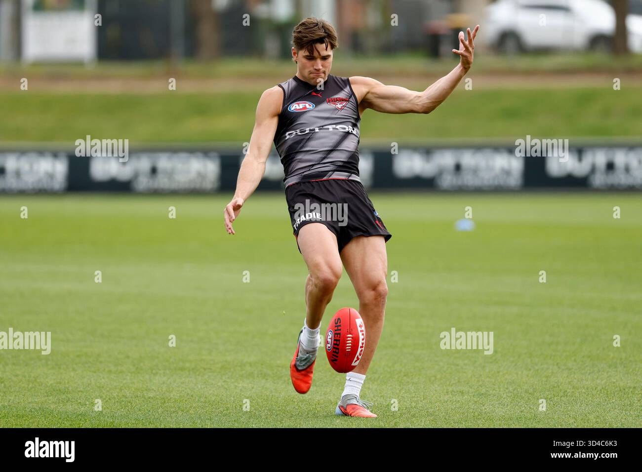 Sam Durham kicks the ball during an Essendon Bombers AFL training ...