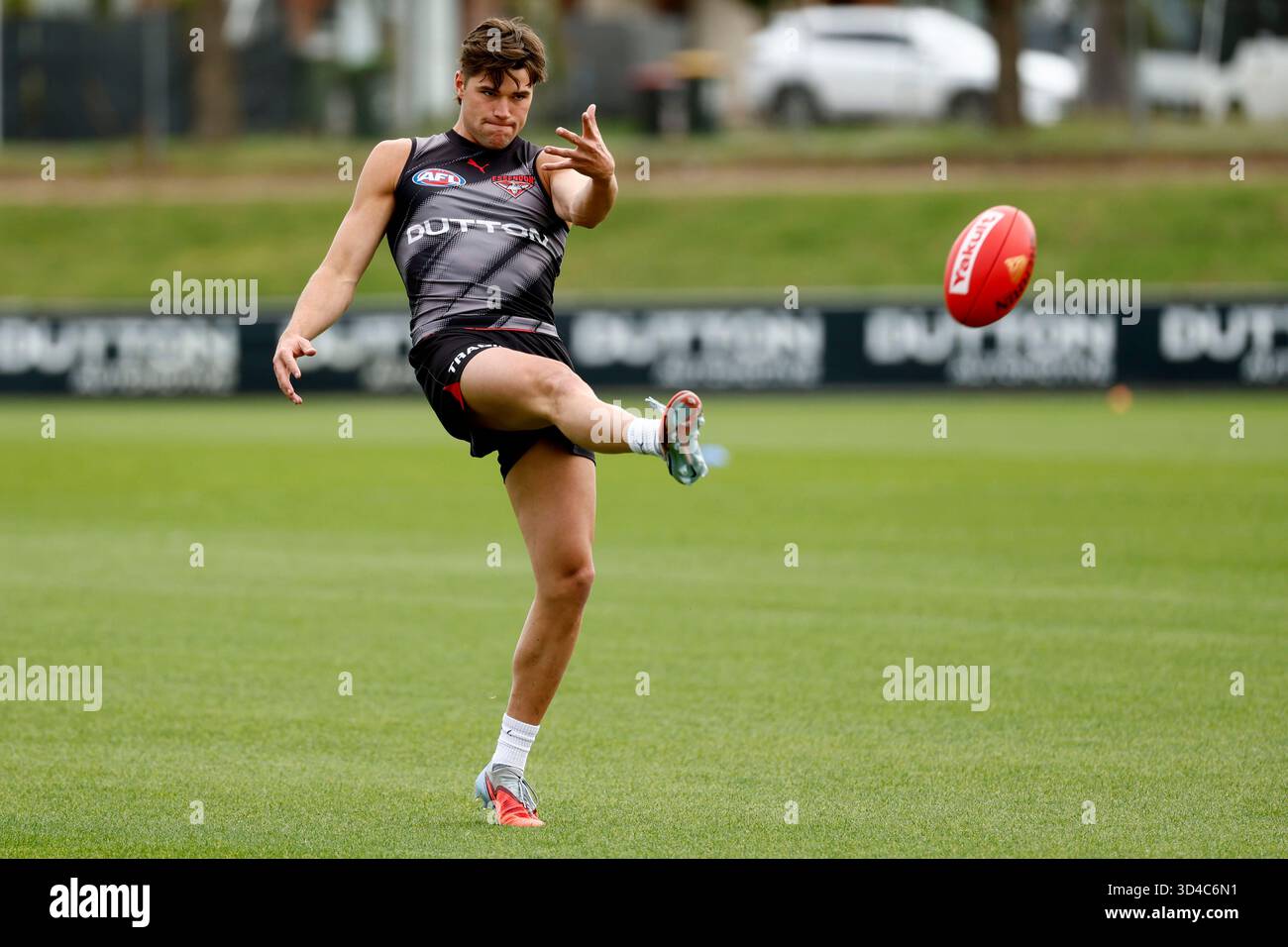 Sam Durham kicks the ball during an Essendon Bombers AFL training ...