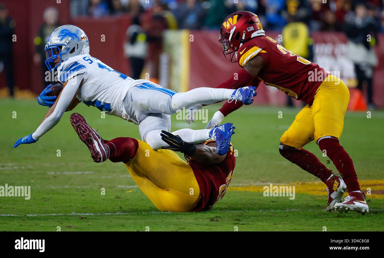 Nov 9, 2025: Detroit Lions WR #14 Amon-Ra St. Brown is tripped up ...