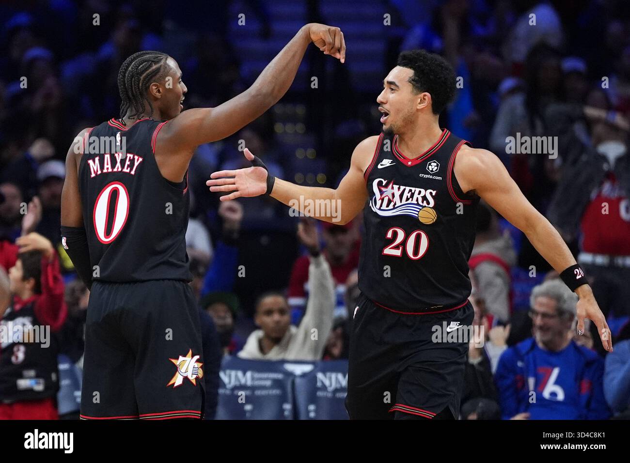 Philadelphia 76ers' Tyrese Maxey, left, and Jared McCain celebrate ...