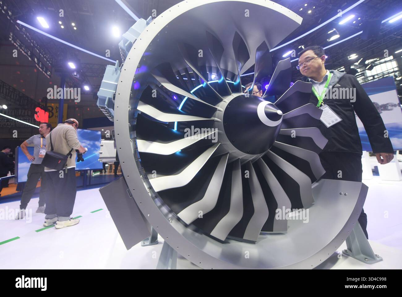A visitor checks out a 1:2 scale model of the core section of the LEAP ...