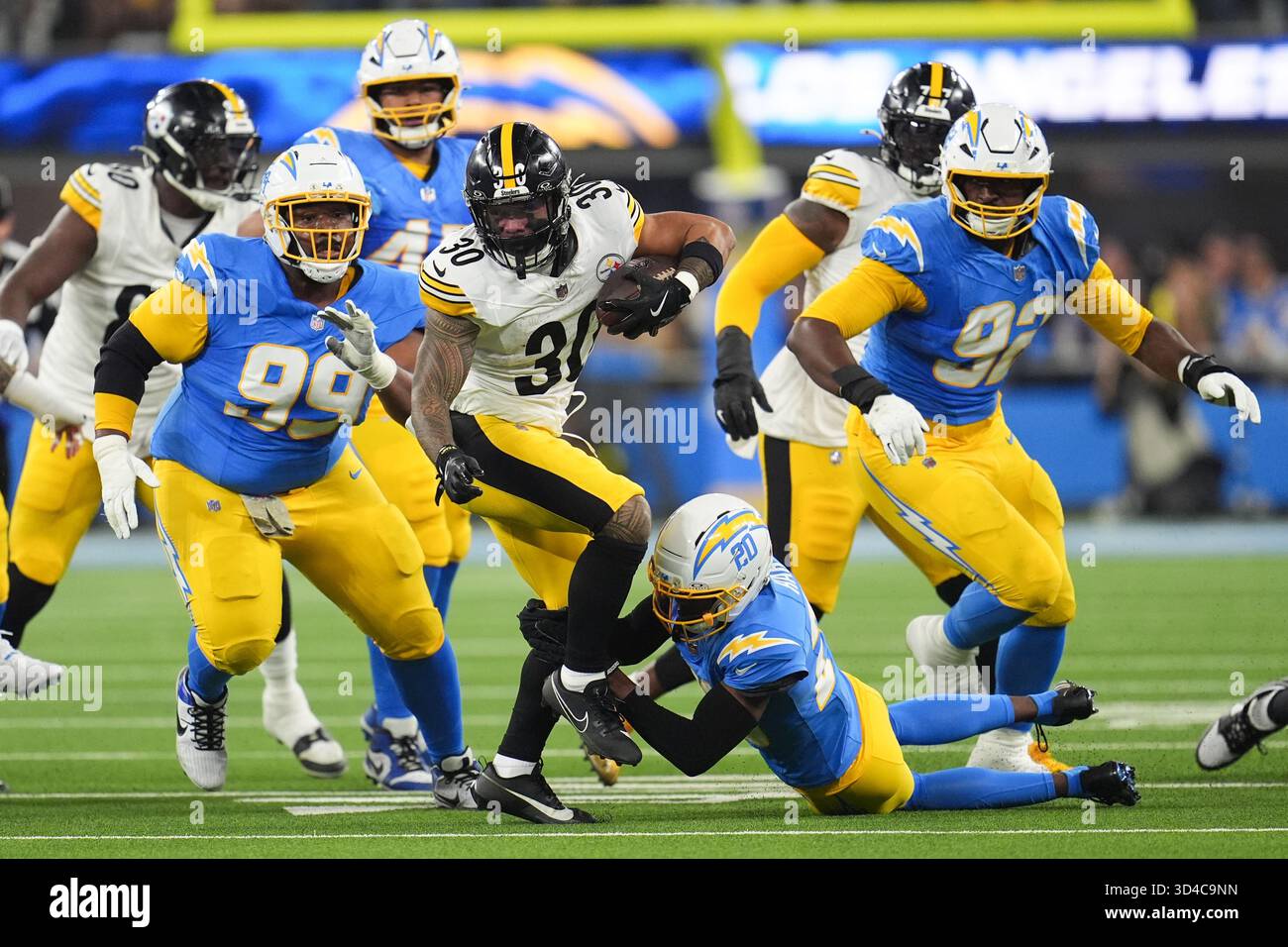 Pittsburgh Steelers running back Jaylen Warren (30) is grabbed by Los ...