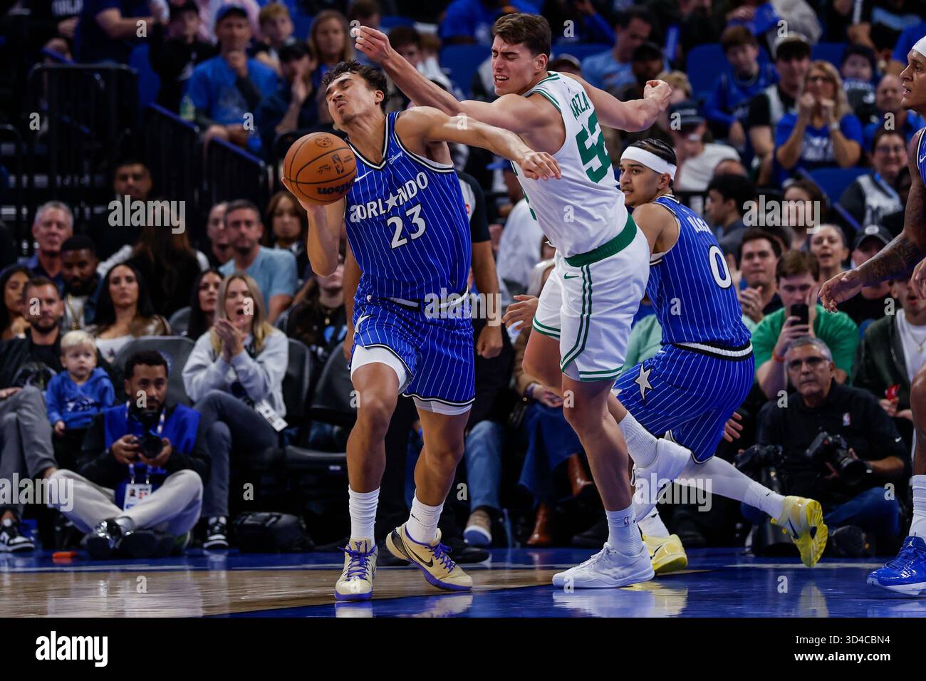 Boston Celtics center Luka Garza, right, fouls Orlando Magic forward ...