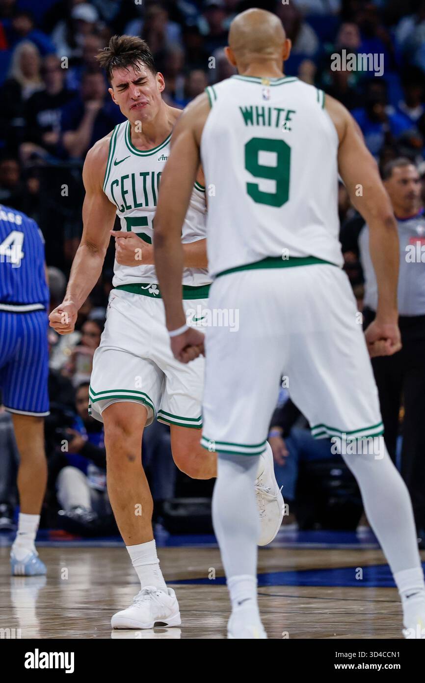 Boston Celtics center Luka Garza, left, reacts while playing the ...