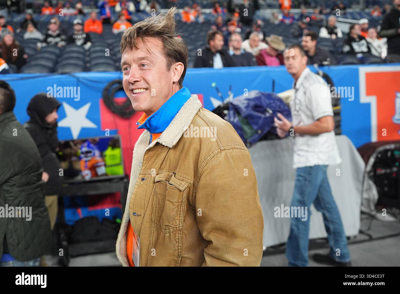 Denver Mayor Mike Johnston looks on before an NFL football game ...