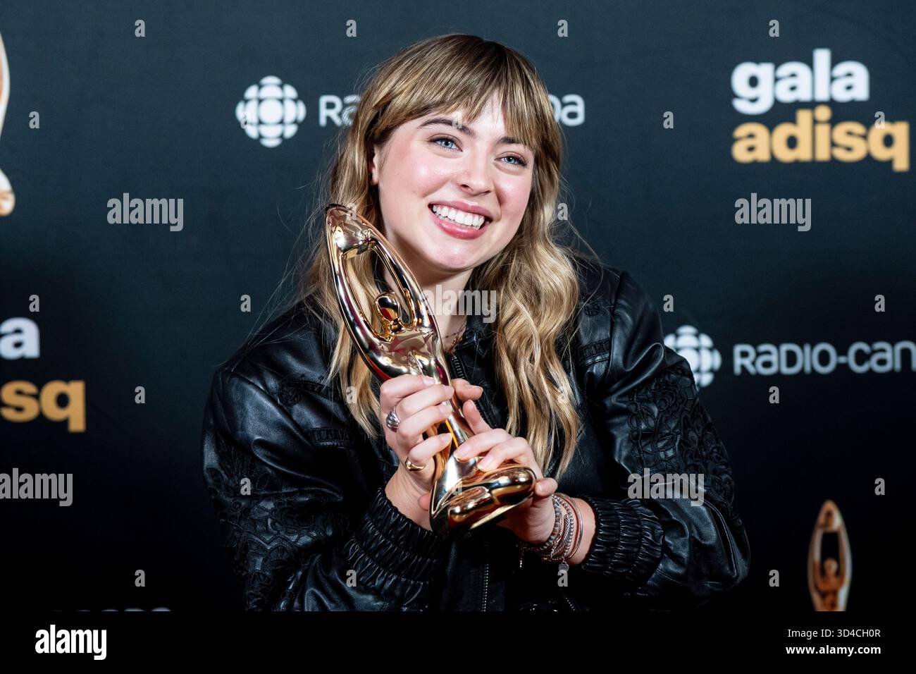 Billie du Page holds up her award during the Gala de l'ADISQ awards ceremony, in Montreal on ...