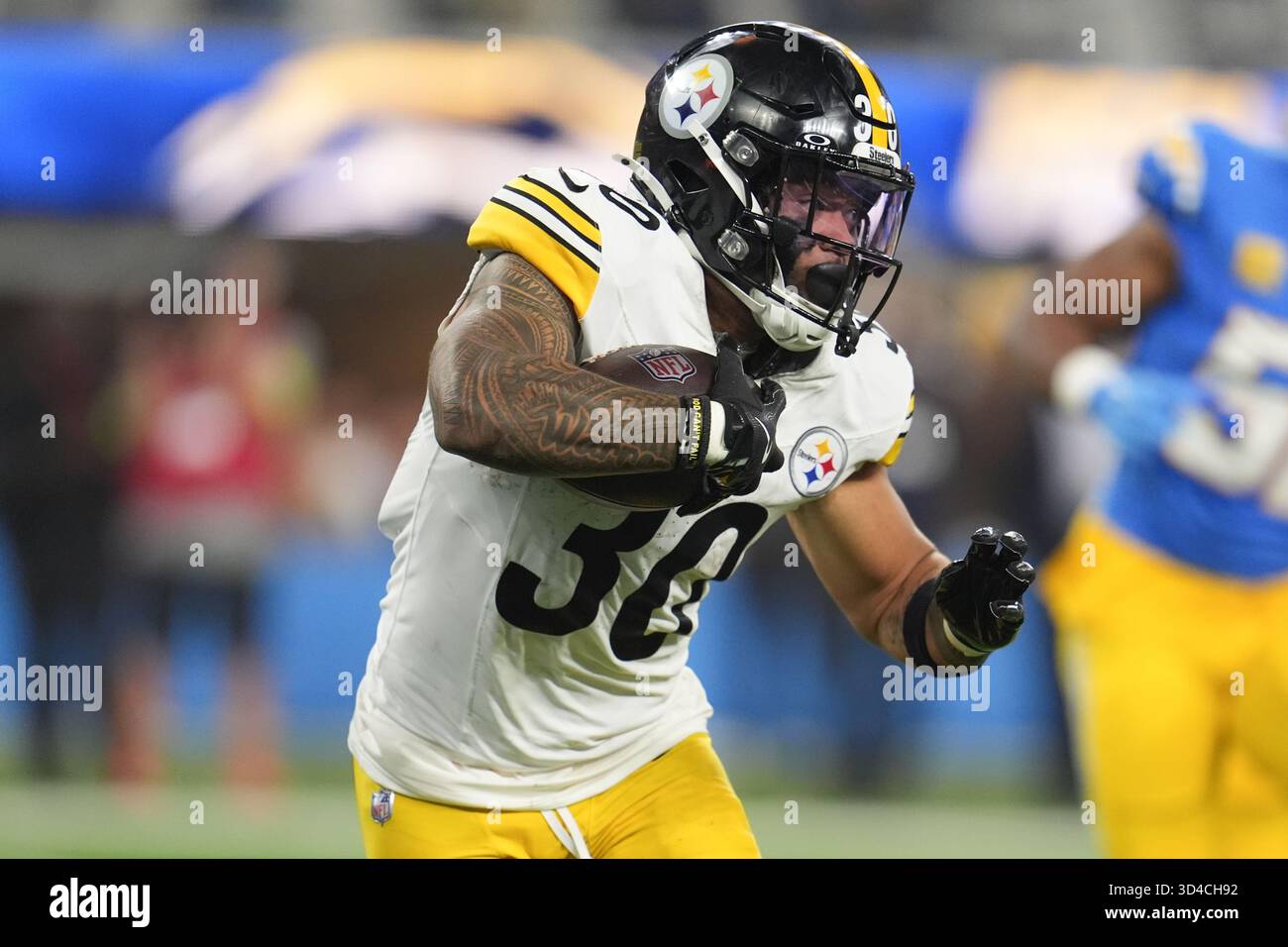 Pittsburgh Steelers running back Jaylen Warren (30) runs the ball ...
