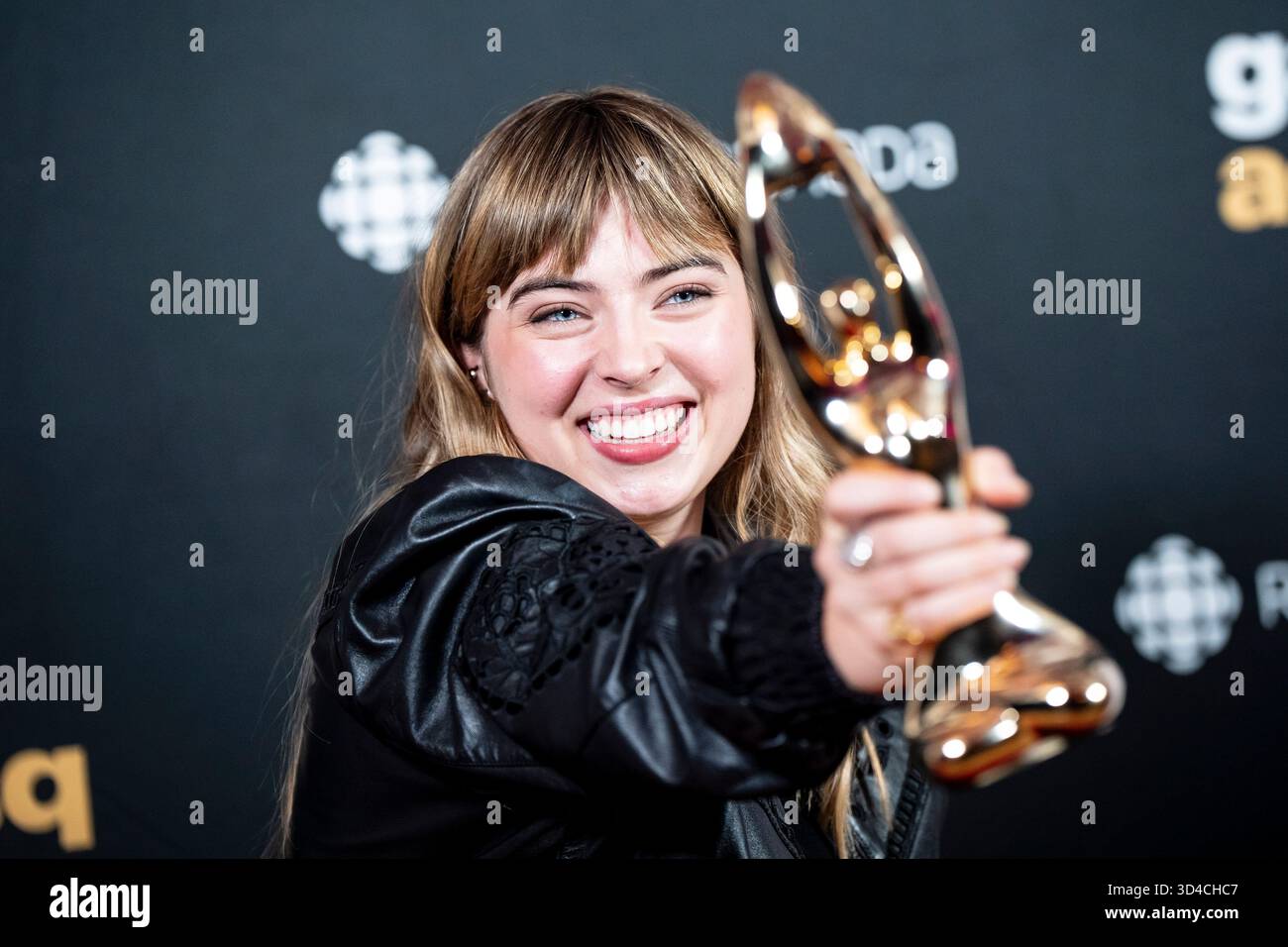 Billie du Page holds up her award during the Gala de l'ADISQ awards ceremony, in Montreal on ...