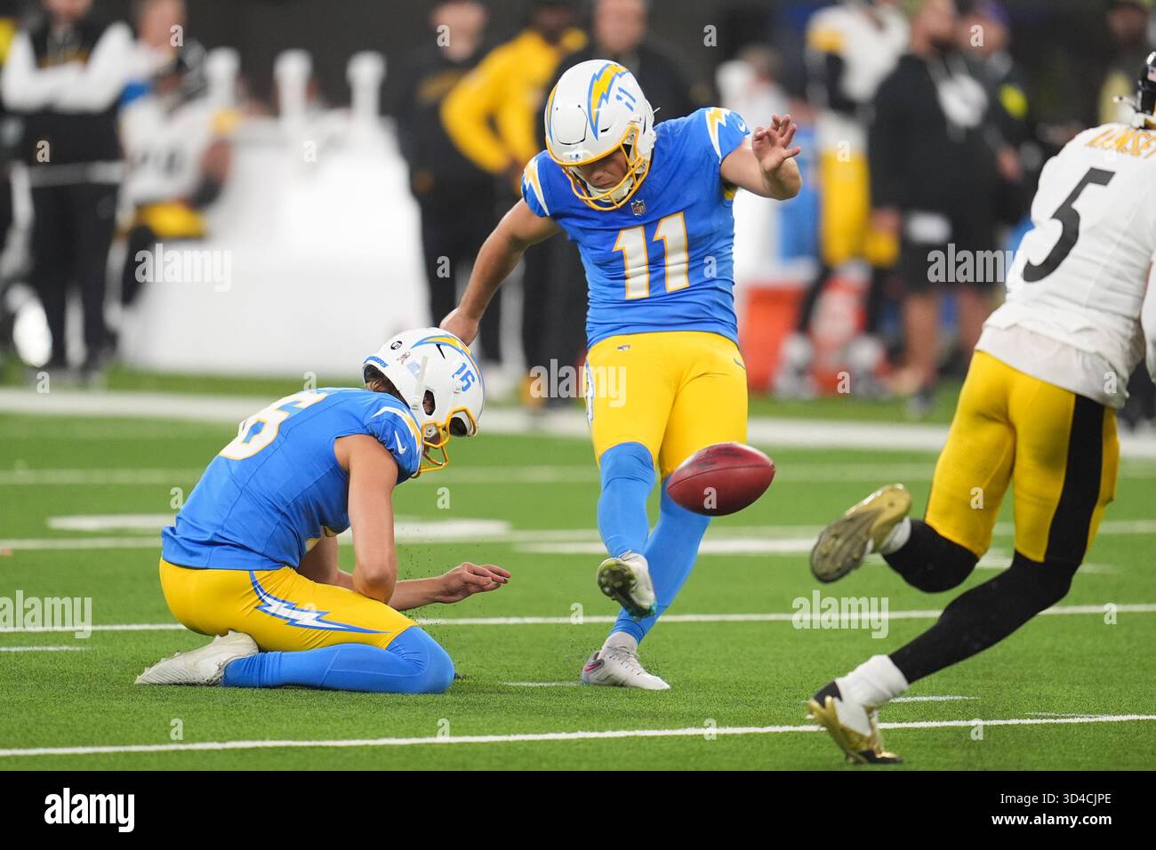 Los Angeles Chargers place kicker Cameron Dicker (11) kicks for a field ...