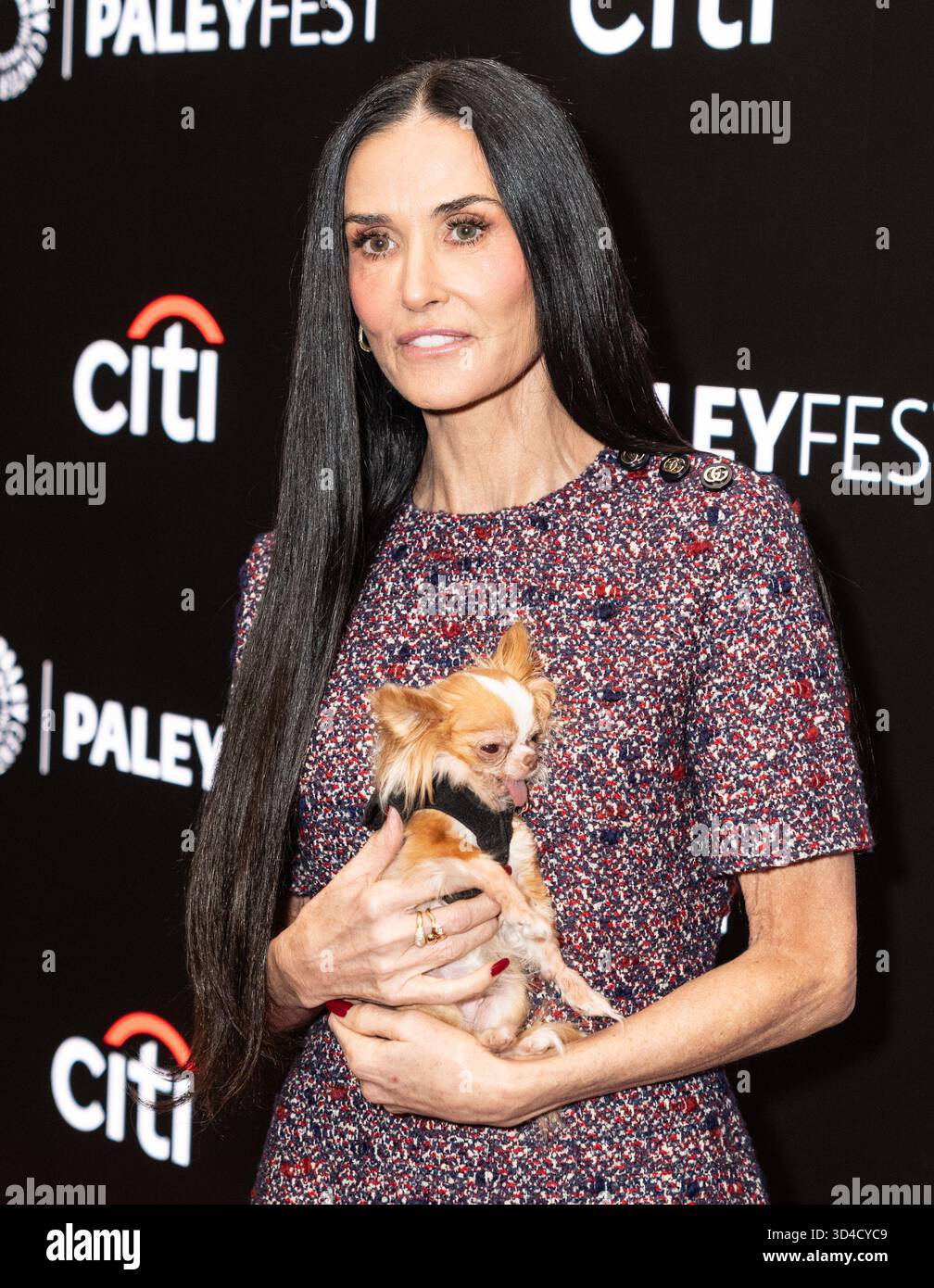 Demi Moore wearing dress by Gucci and holding dog Pilaf attends photo ...