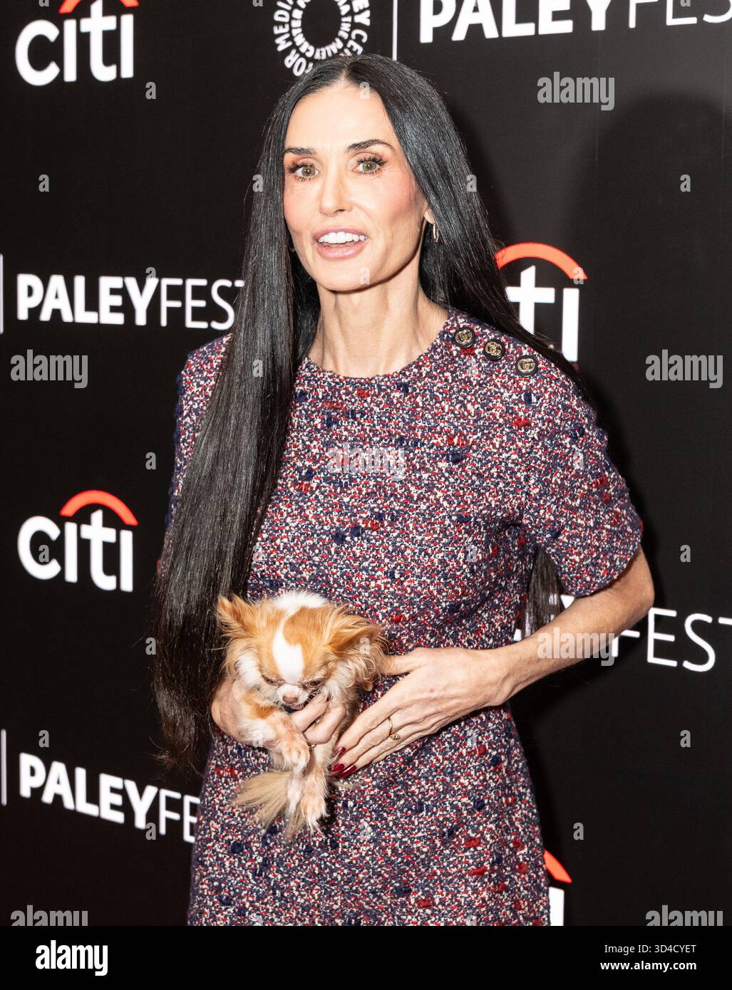 Demi Moore wearing dress by Gucci and holding dog Pilaf attends photo ...