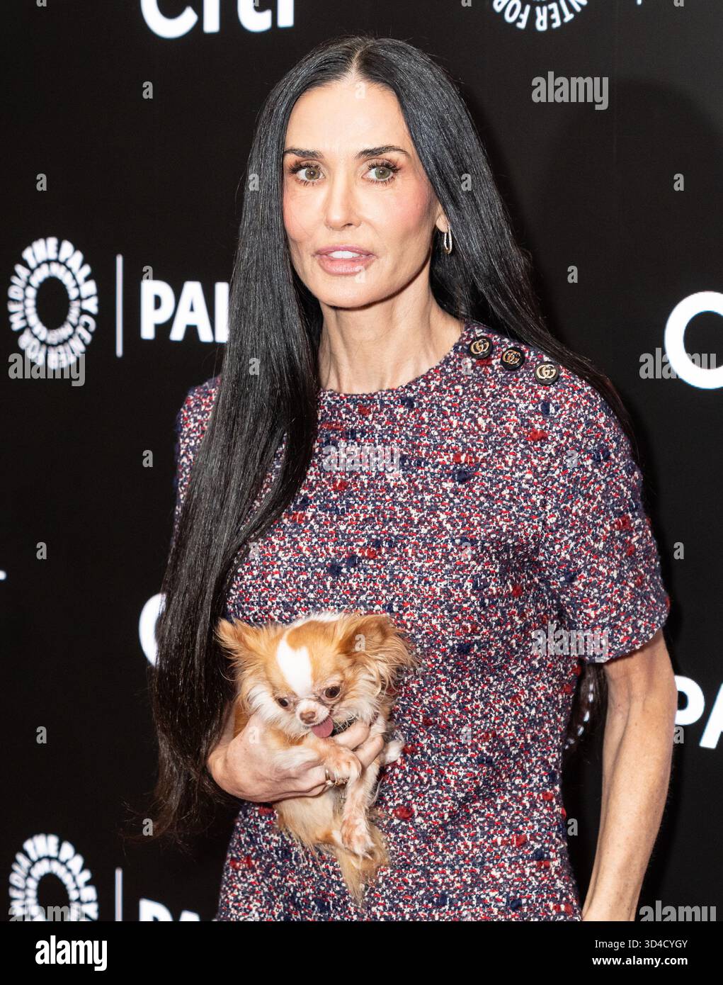 Demi Moore wearing dress by Gucci and holding dog Pilaf attends photo ...