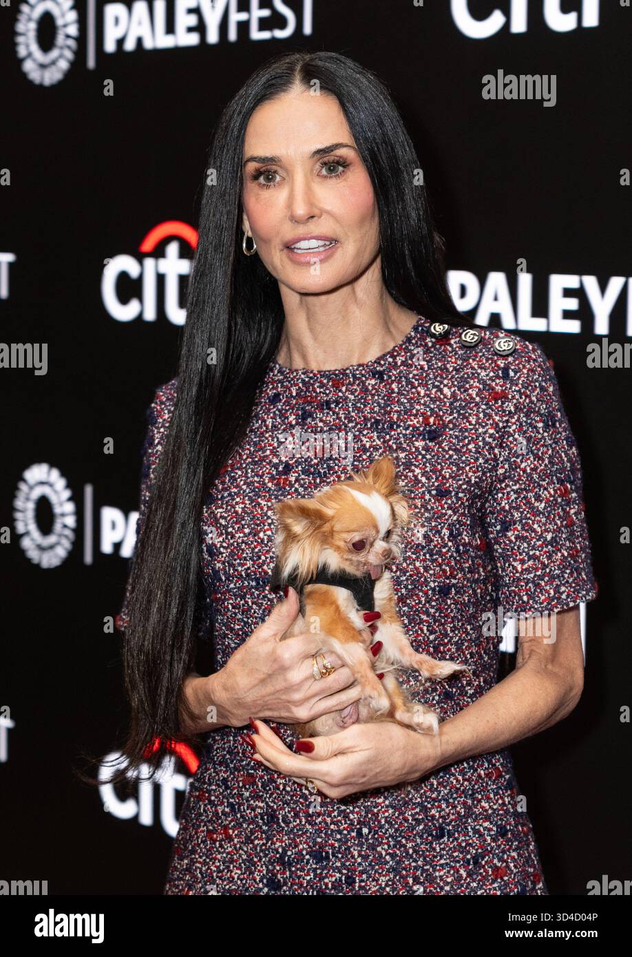 Demi Moore wearing dress by Gucci and holding dog Pilaf attends photo ...