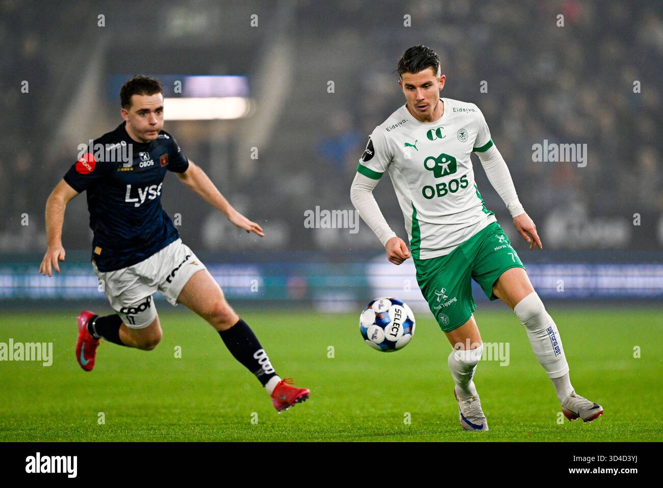 Stavanger 20251108. Edvin Austbø and HamKam's Vidar Ari Jónsson during ...