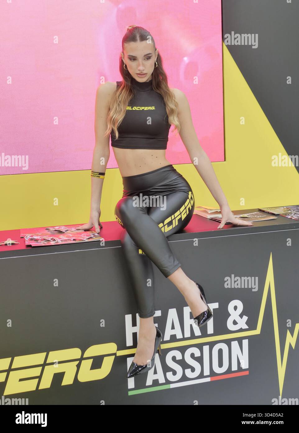 The Eicma Girls, a parade of models riding high-quality motorcycles at ...