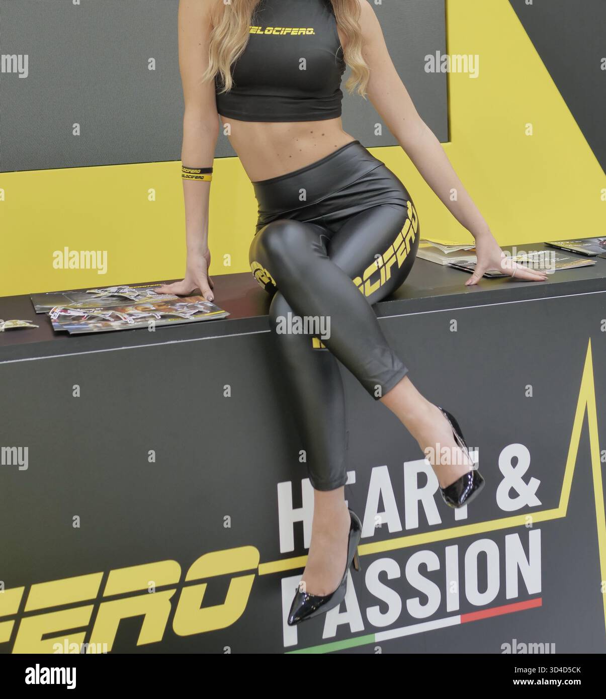 The Eicma Girls, a parade of models riding high-quality motorcycles at ...