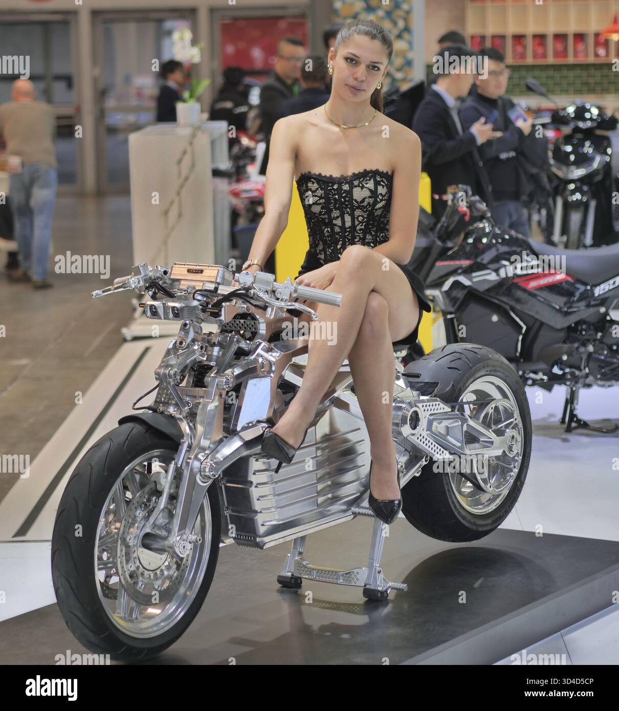 The Eicma Girls, a parade of models riding high-quality motorcycles at ...