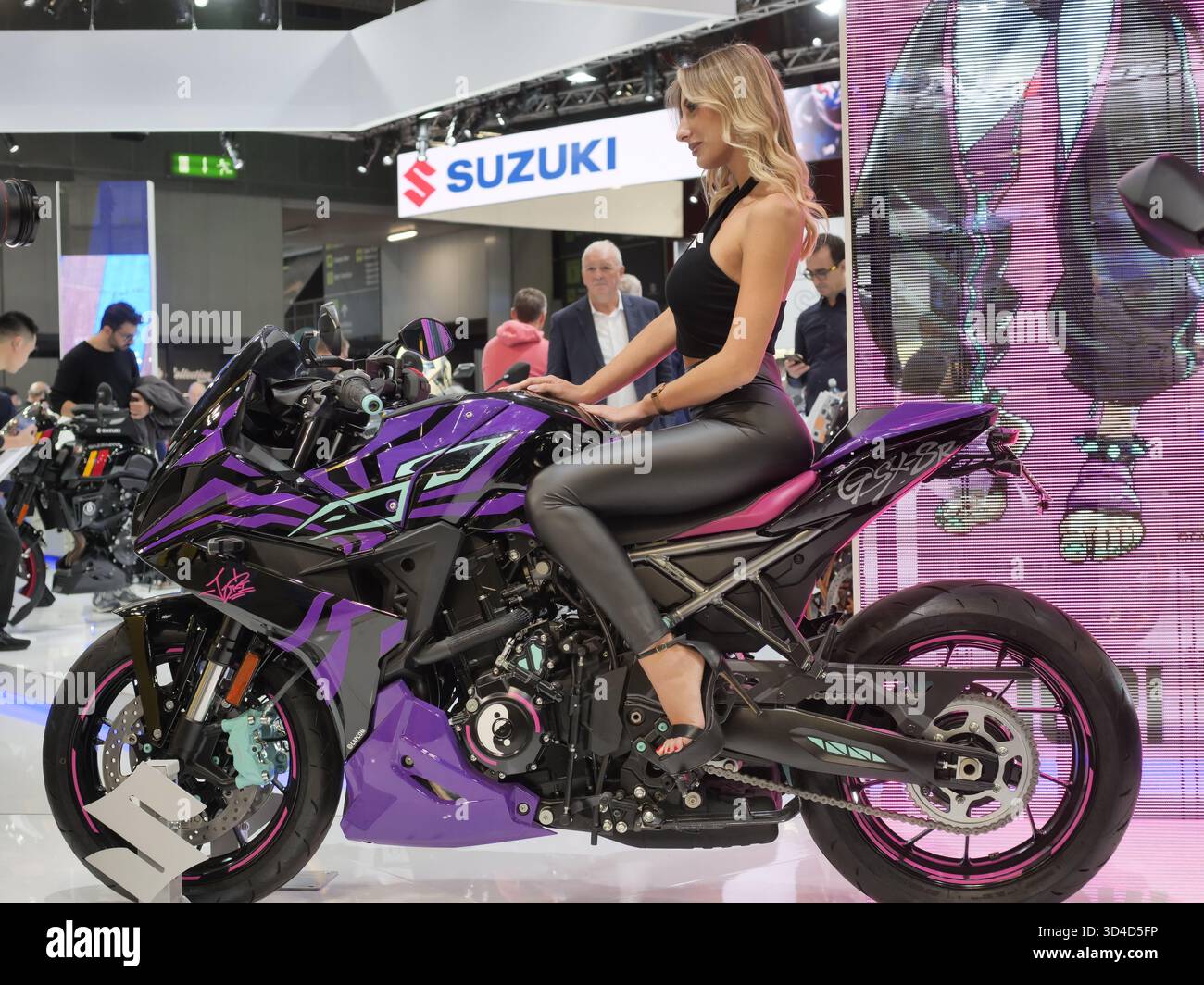 The Eicma Girls, a parade of models riding high-quality motorcycles at ...