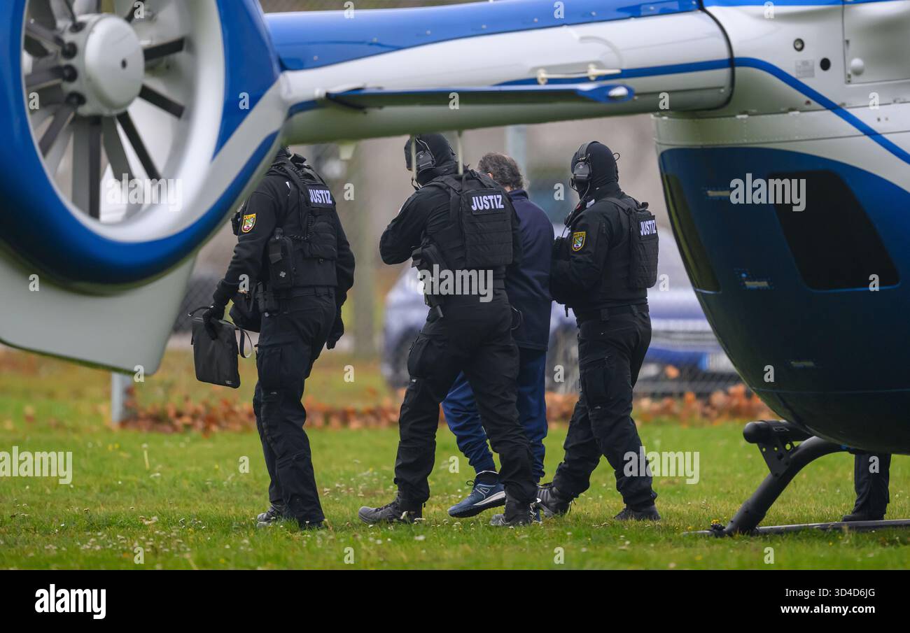 Taleb al-Abdulmohsen, is led to the motorcade by judicial staff after ...