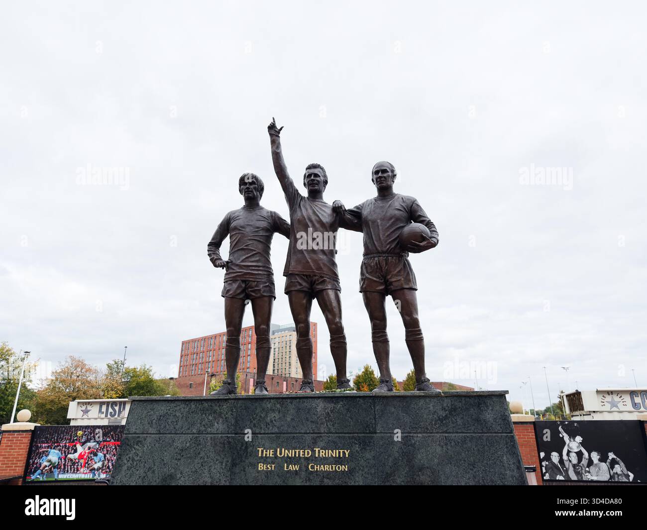 Manchester, UK - September 30, 2025: Bronze statue of three football ...