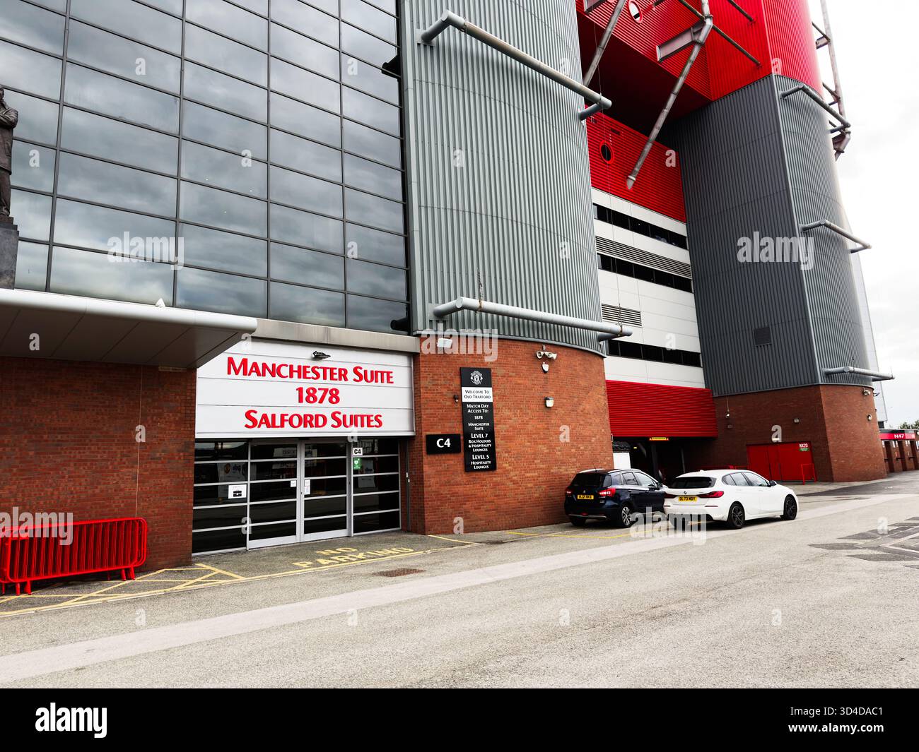 Manchester, UK - September 30, 2025: Modern stadium complex with brick ...