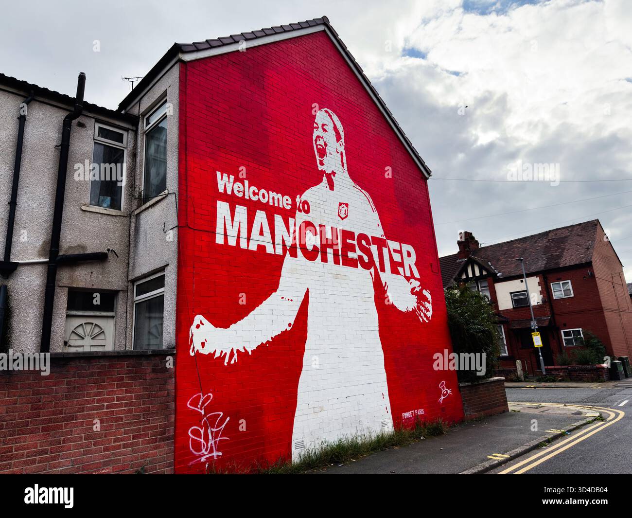 Manchester, UK - September 30, 2025: A bold red wall mural in ...
