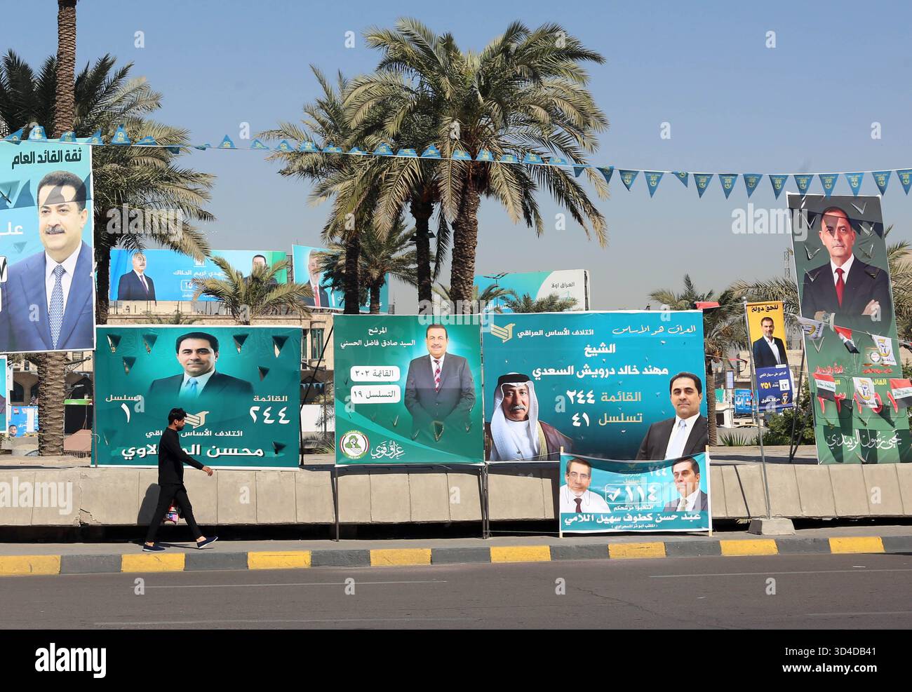 (251110) -- BAGHDAD, Nov. 10, 2025 (Xinhua) -- A man walks past ...