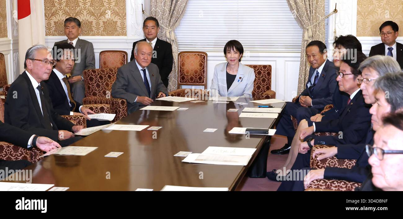 Japanese Prime Minister Sanae Takaichi (center) attends the Board of ...