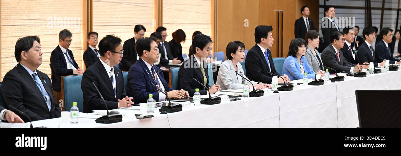 Japanese Prime Minister Sanae Takaichi, wearing a grey jacket, speaks ...