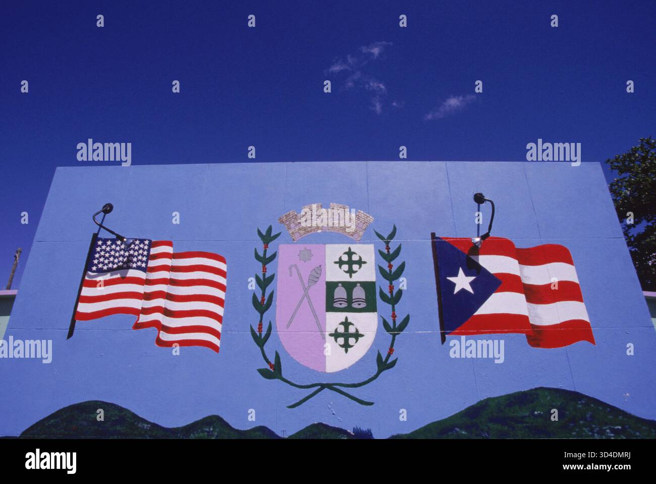 A mural of the U.S. and Puerto Rican flags in Adjuntas town square ...