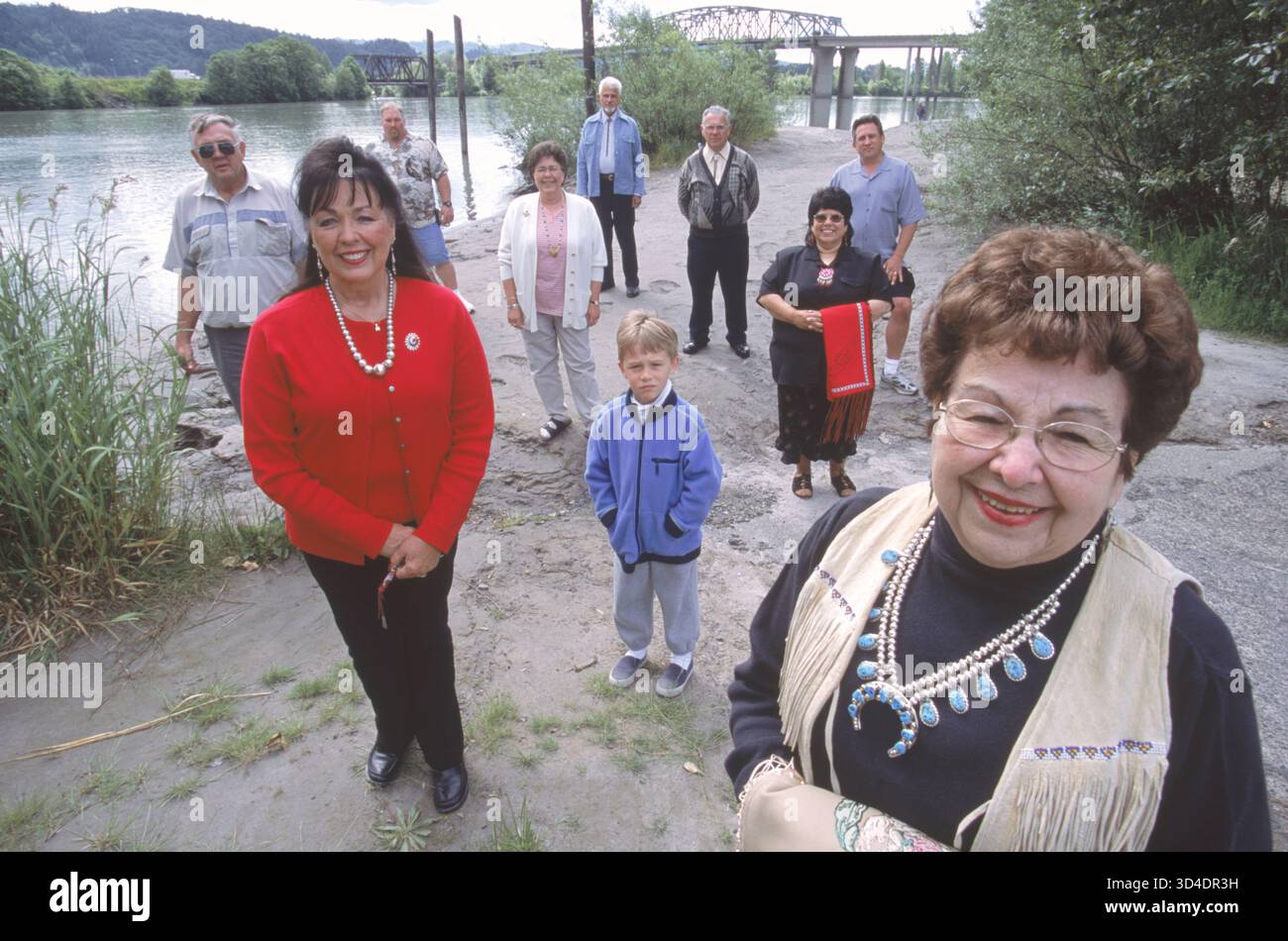 Elders and council members of the Cowlitz Tribe stand on the banks of ...
