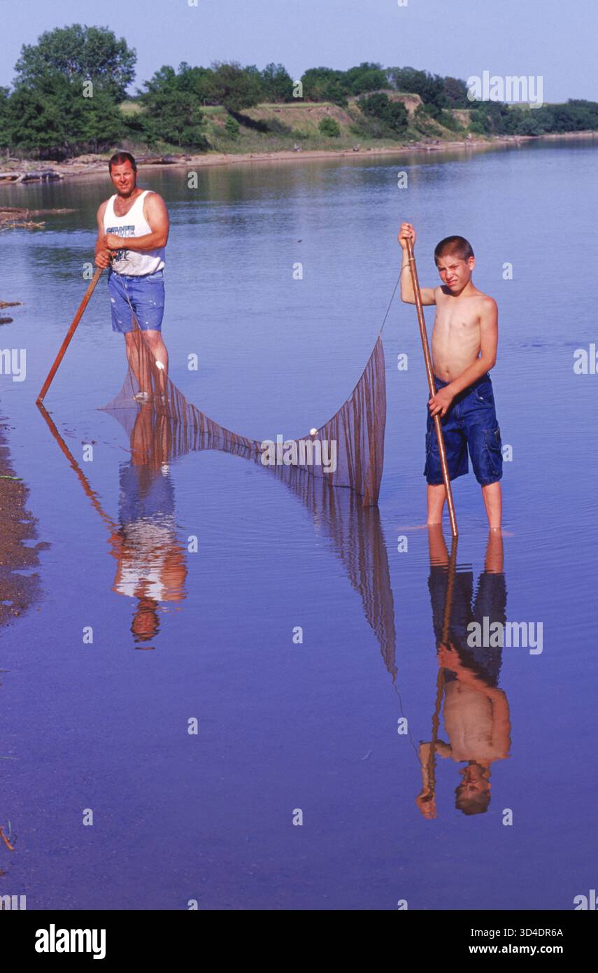 Gary Kriz, 35, and his sone Ryan, 11 on the banks of the missouri ...
