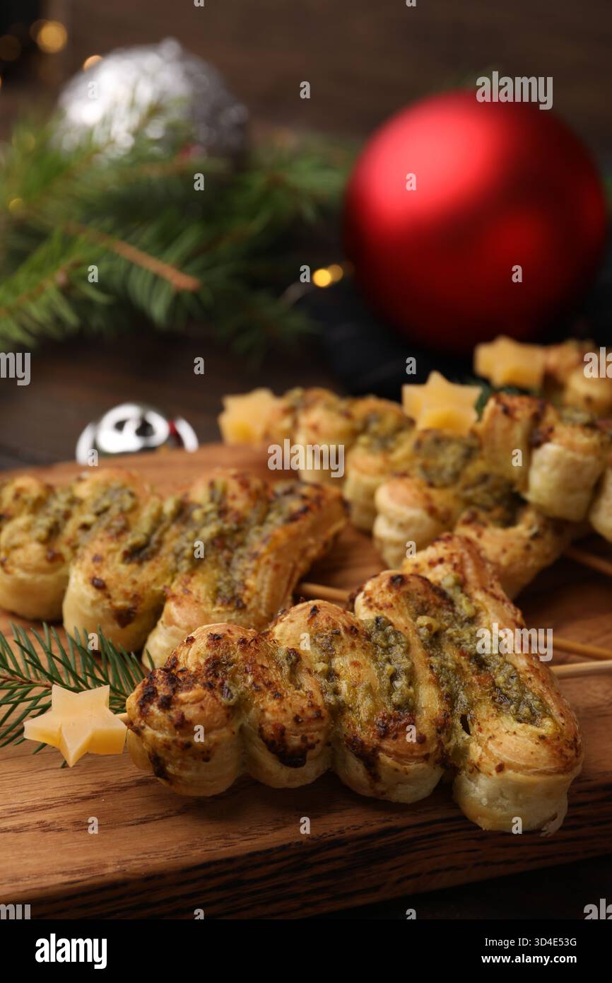 Christmas trees made with puff pastry, pesto sauce, cheese and festive ...