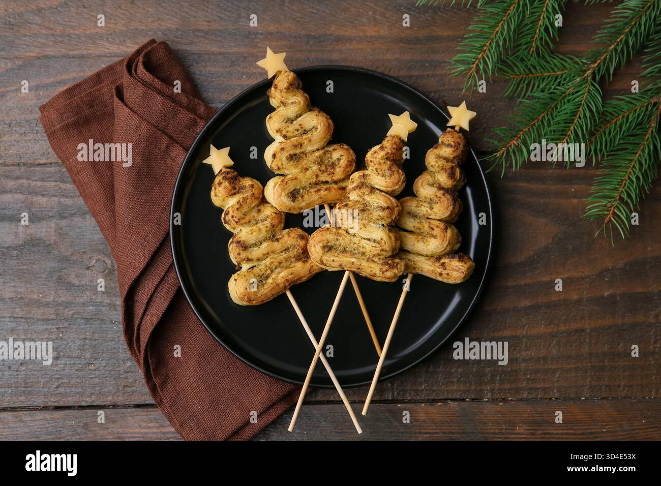 Christmas tree shaped snacks made with puff pastry, pesto sauce, cheese ...