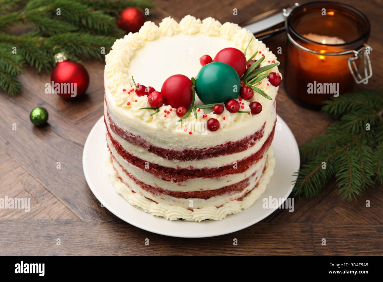 Delicious sponge cake with Christmas decor and red currants on wooden ...