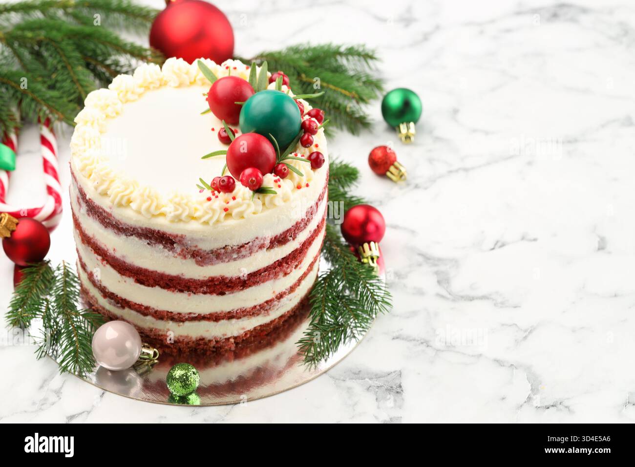 Delicious sponge cake with Christmas decor and red currants on white ...