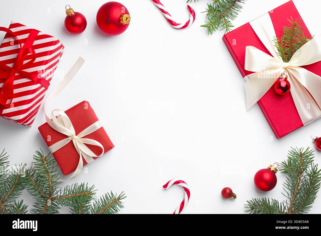 Frame made of fir tree branches, gift boxes and Christmas decor on ...