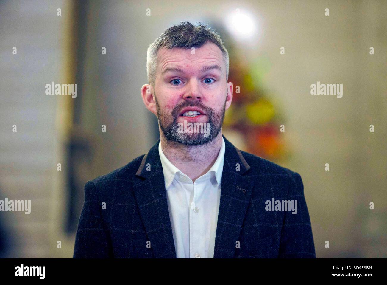 People Before Profit MLA Gerry Carroll speaks to the media during a ...