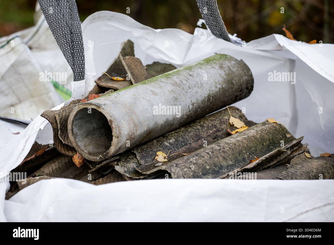 Asbestos Cement Pipes and Roofing Waste in a white construction bag ...