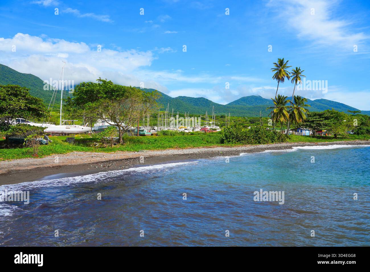 Black Sand Beach and Boatyard in New Guinea town on the west coast of ...