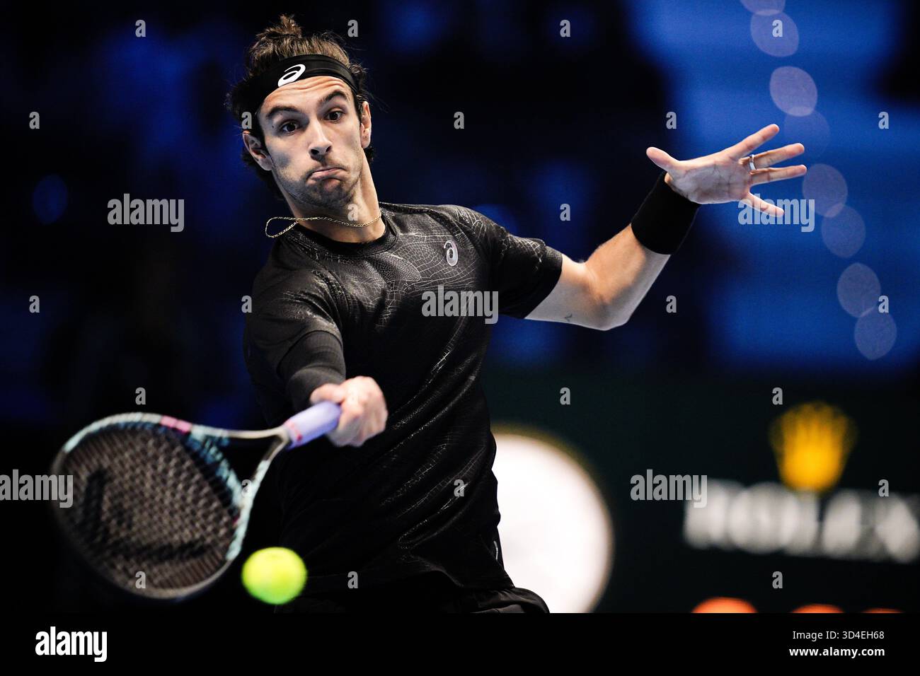 Italy's Lorenzo Musetti returns the ball to United StatesÕ Taylor Fritz ...