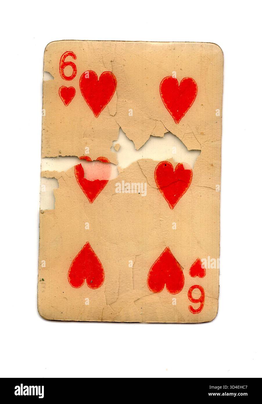 A badly damaged vintage playing card in the suit of hearts isolated on ...