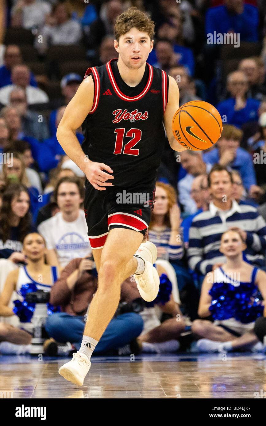 South Dakota guard Isaac Bruns (12) brings the ball up the court ...