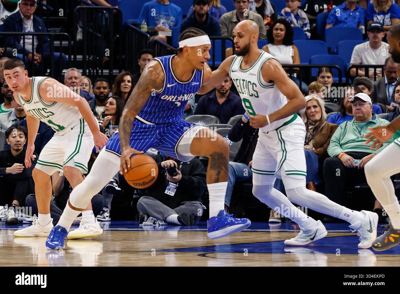 Orlando Magic forward Paolo Banchero, left, is defended by Boston ...