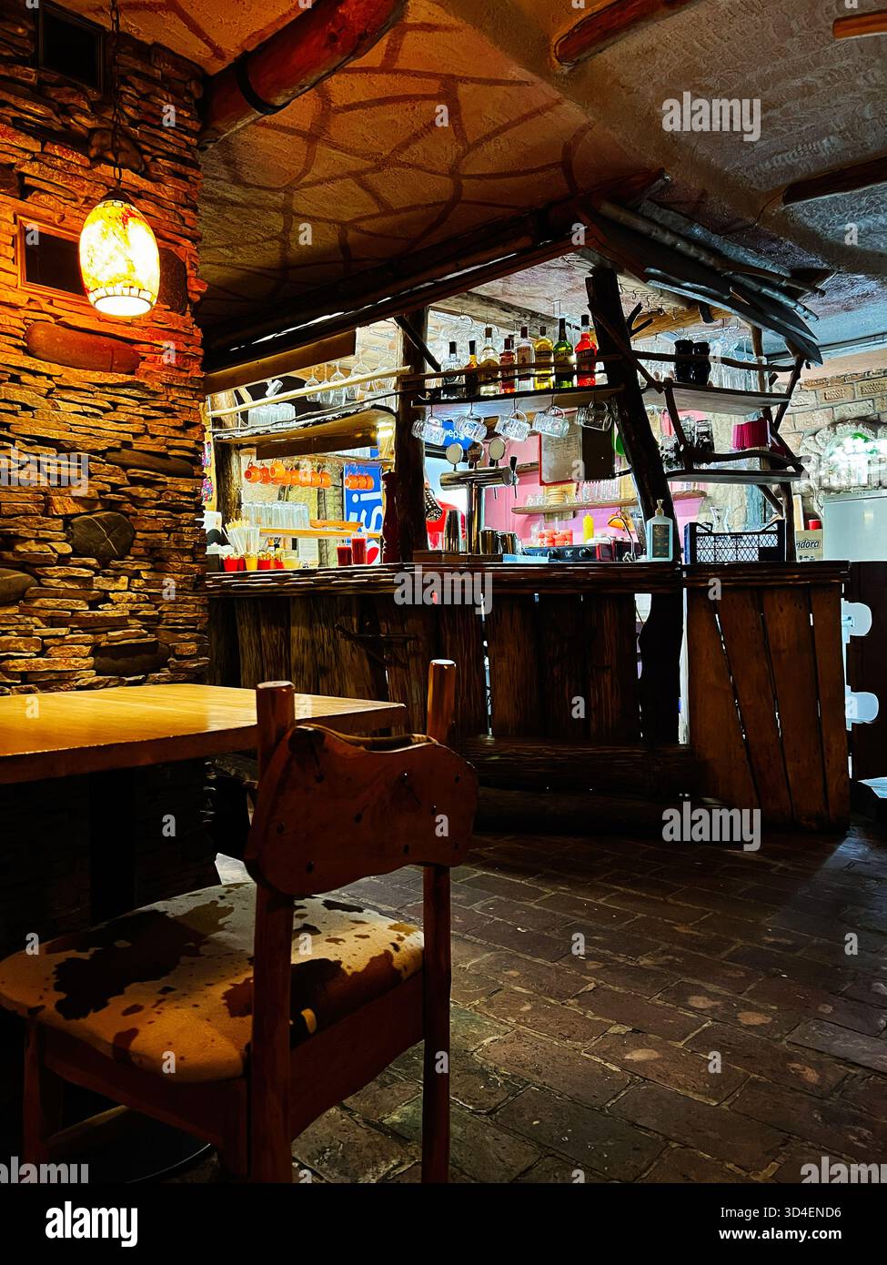 Kyiv, Ukraine - November 10, 2025: A rustic cozy bar scene with warm ...