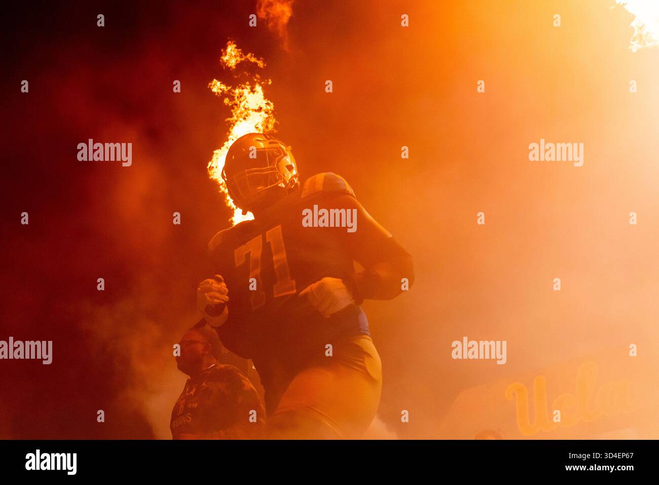 UCLA offensive lineman Reuben Unije (71) runs onto the field before an ...